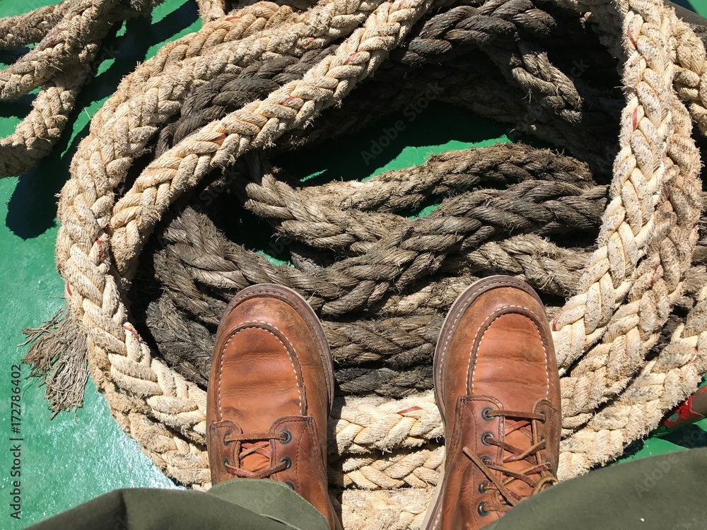 Travel in summer time with vintage boot, old rope on the boat floor ...
