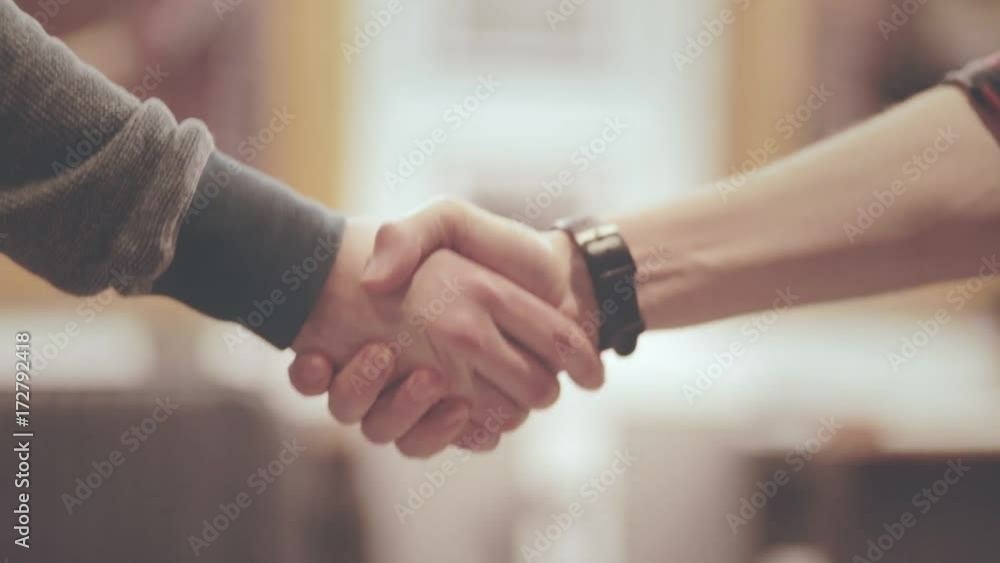 Handshake man. Friendly handshake of two men. Close up of men greeting ...