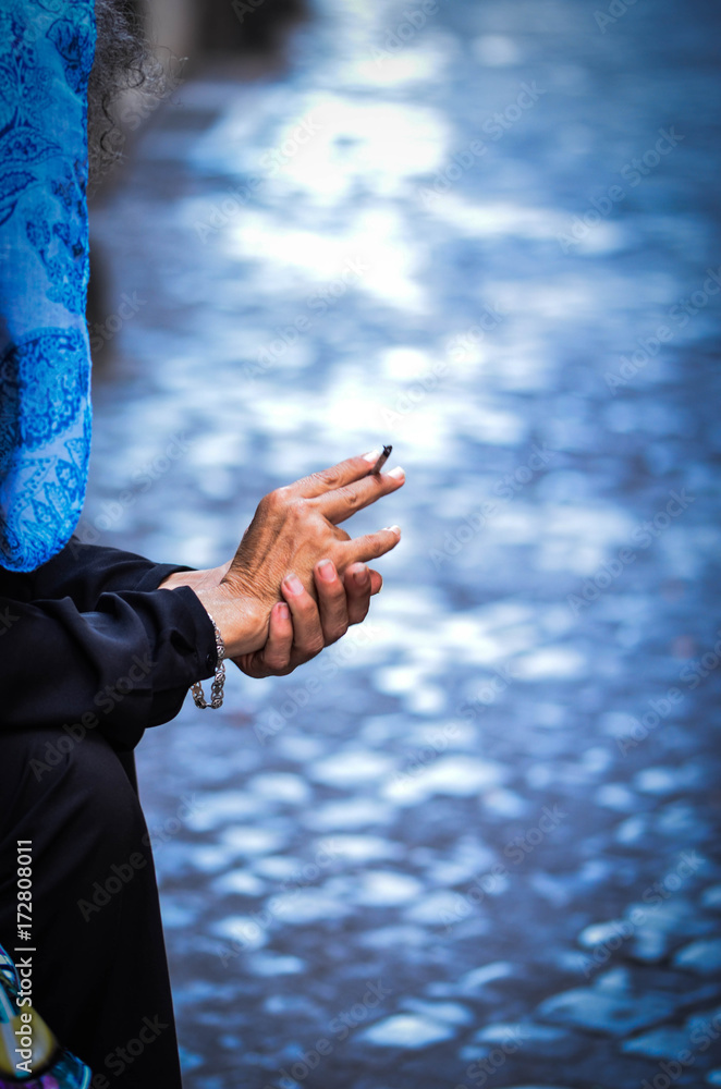 homeless woman smoking a cigar on the streets of Rome Stock Photo ...
