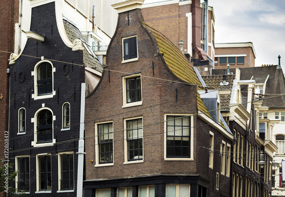 Typical old skewed and tilted buildings on one of Amsterdam's street ...