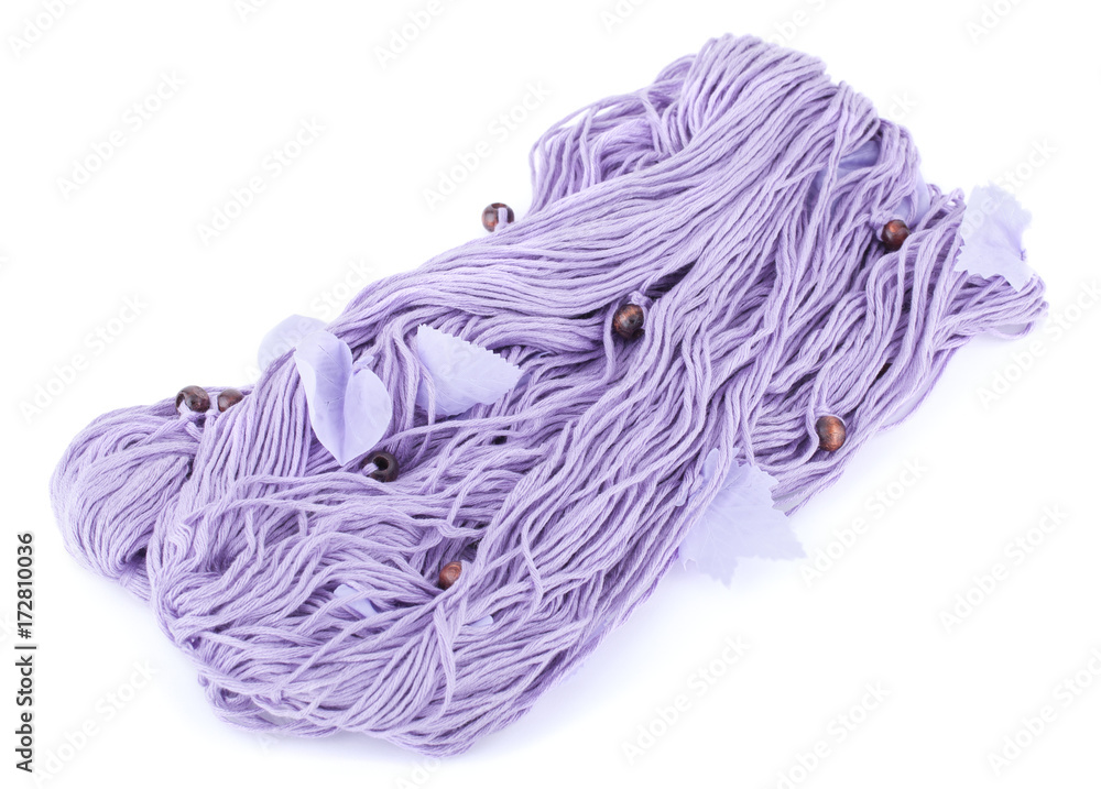 Purple yarn with wooden balls and textile leaves isolated on white ...