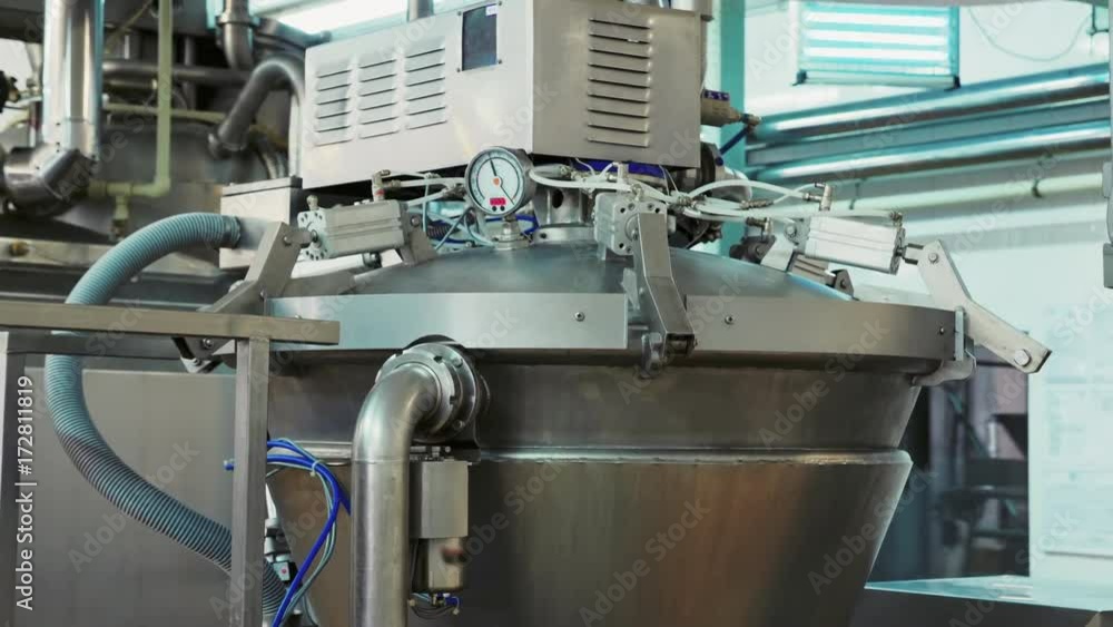 The process of heating milk in a pasteurization tank. Dairy factory ...