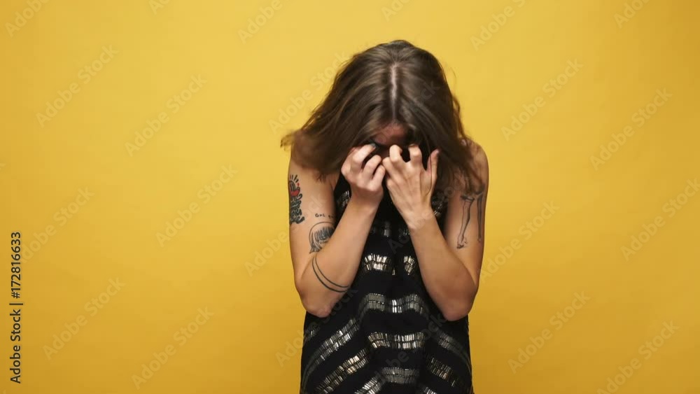 Crazy brunette woman with haloween make up laughing and looking camera ...
