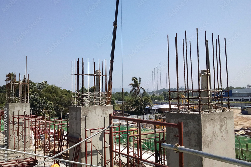 Casted concrete column at the construction site. Provided protruding ...