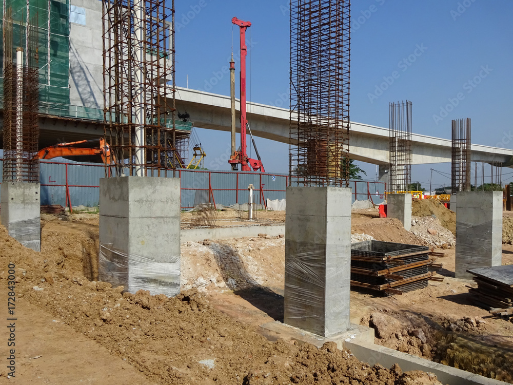 Casted concrete column at the construction site. Provided protruding ...