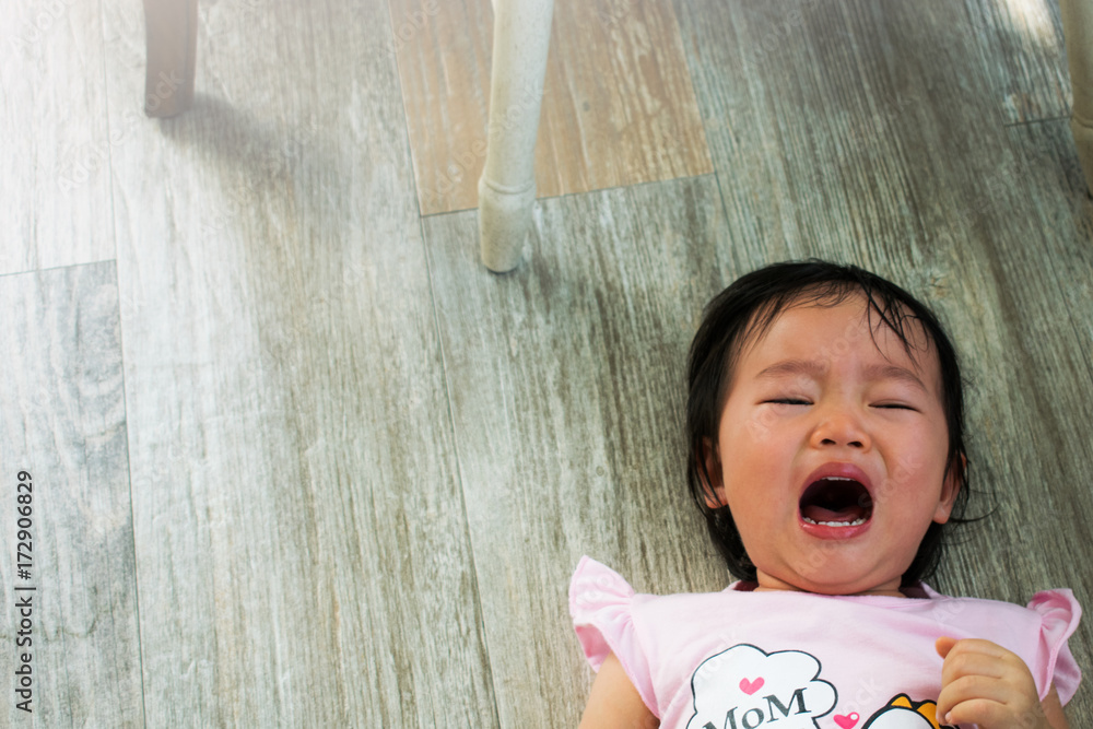 Poster Little girl crying on the floor. Terrible two period. – Wall Art ...