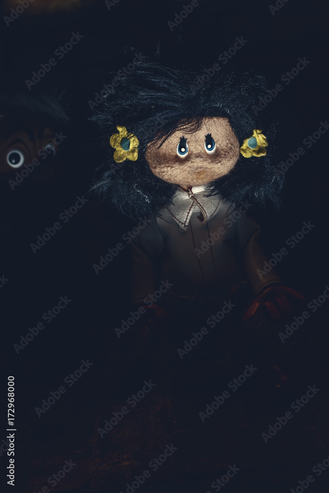 Possessed dolls emerge from darkness. Halloween nightmare. Original ...