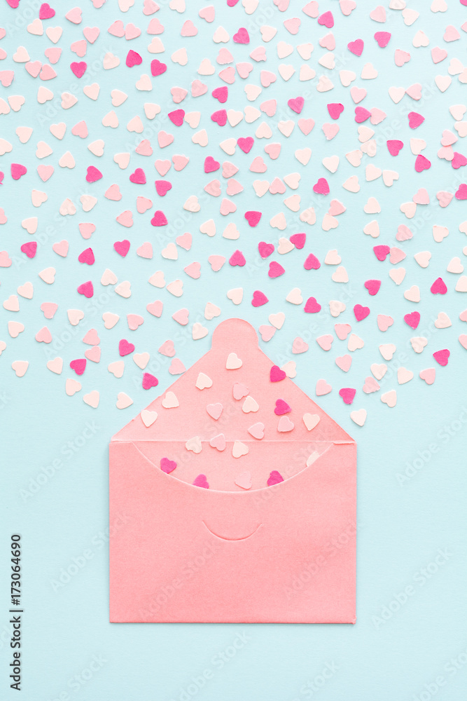 Exploding pink heart confetti from envelope on blue background Stock ...
