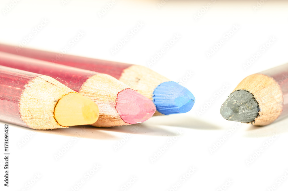 coloured pencils with CMYK nuances, four coloured pencil lay over white ...