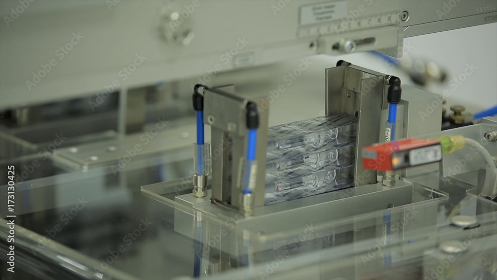 Interior of a pharmaceutical industry equipment for packing pills boxes ...