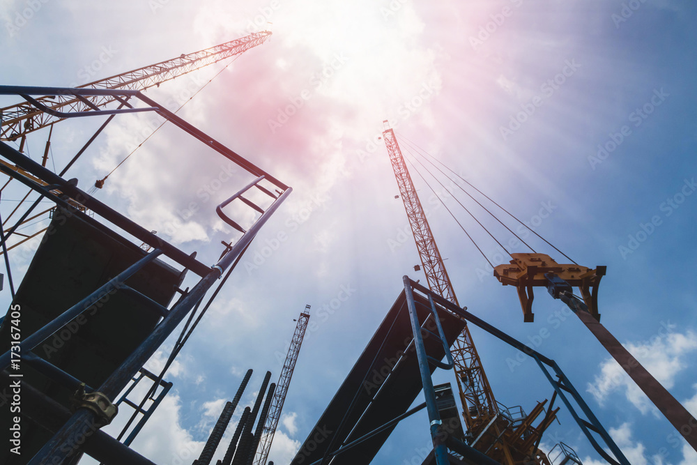Abstract real estate construction site buildings with sky and sun ray ...