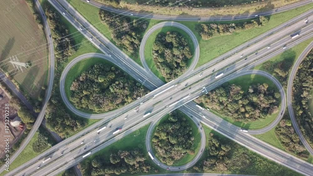 Aerial view of a highway intersection with a clover-leaf interchange ...