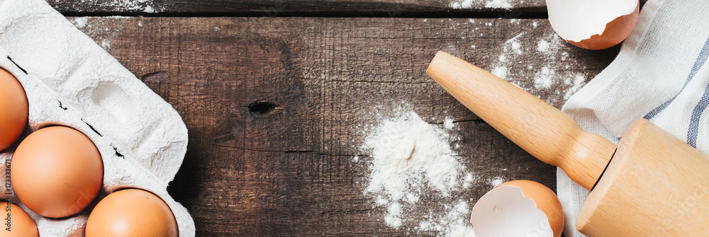 Baking or cooking wooden background with cookies molds, flour, milk ...