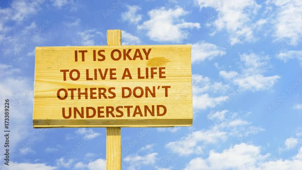 It's okay to live a life others don't understand. Words on a wooden ...