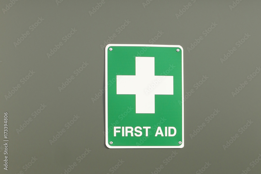 green and white First Aid sign and cross Stock Photo | Adobe Stock