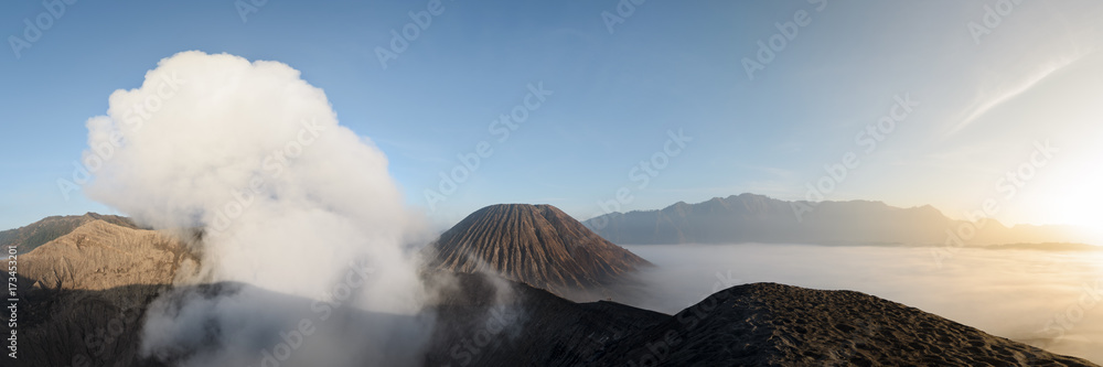 Volcano panorama and fumes at sunrise. From the crest of Bromo's inner ...