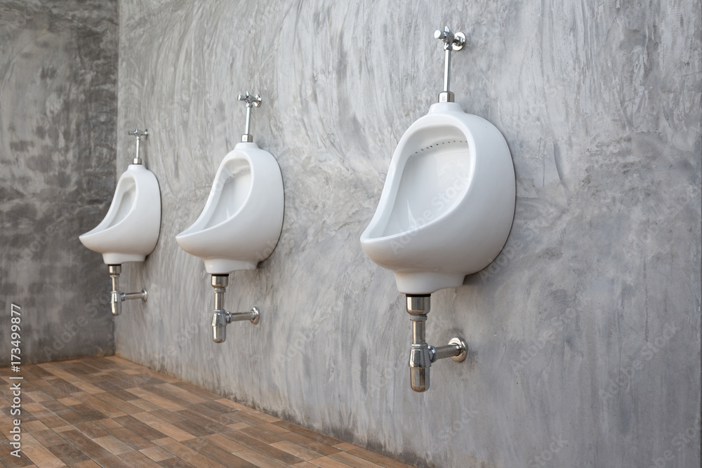Male urinal sanitary ware in office modern loft style Stock Photo ...