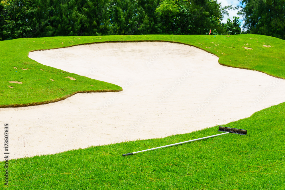 bunker or sand trap with rake Stock Photo | Adobe Stock