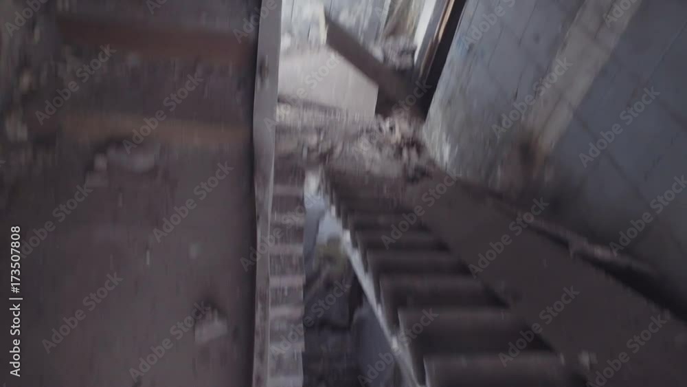 Camera moves along upstairs in empty building destroyed by earthquake ...