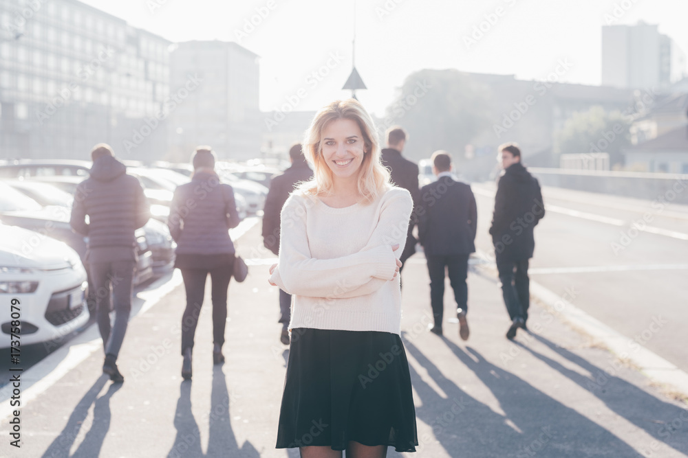 young woman outdoor back light posing looking camera smiling - serene ...