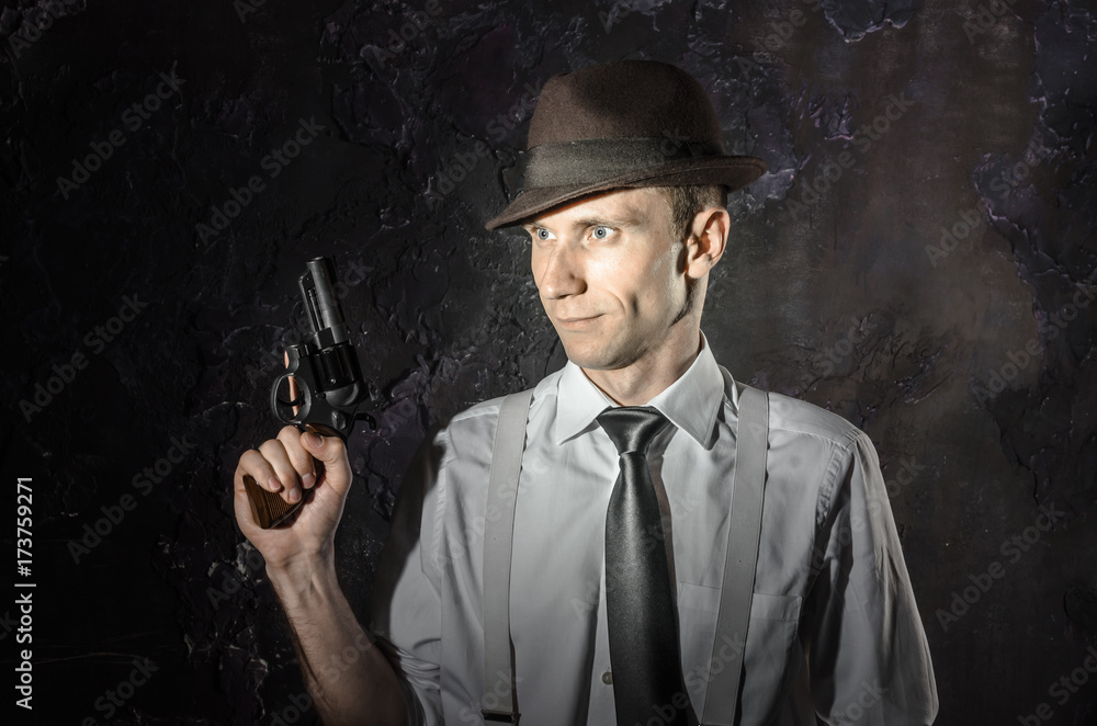 Black and white picture of private detective with gun in both hands ...