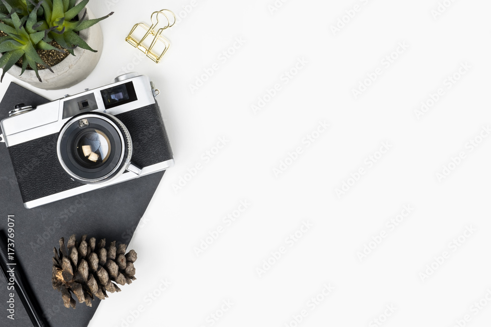 White photographer desk table with film camera and office supplies. Top ...