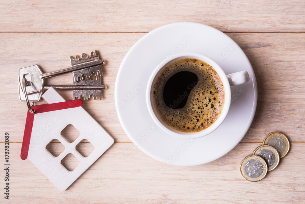 Top view of coffee cup and house model with keys Stock-Foto | Adobe Stock