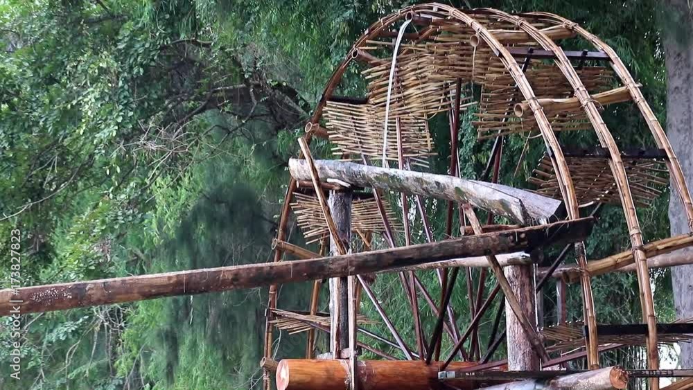 Historic Water wheel on farm used for irrigated rice field. Watering ...