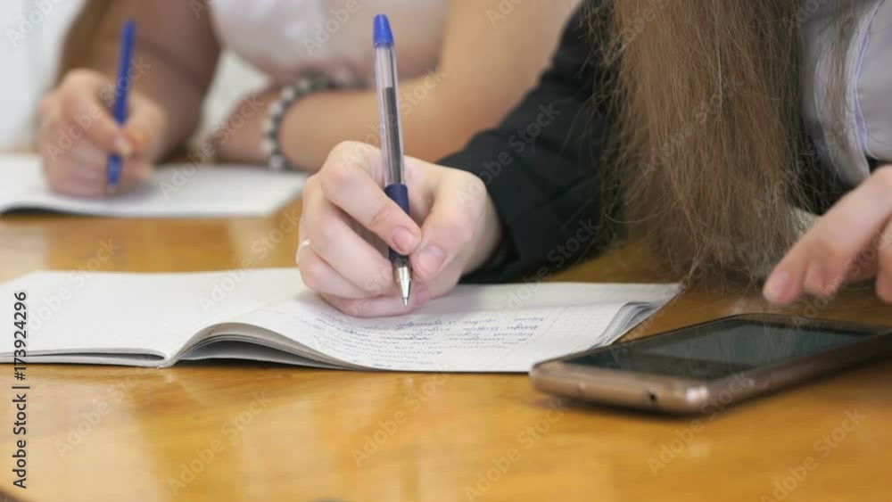 Video Stock Student dressed in a black suit sits at a school desk ...