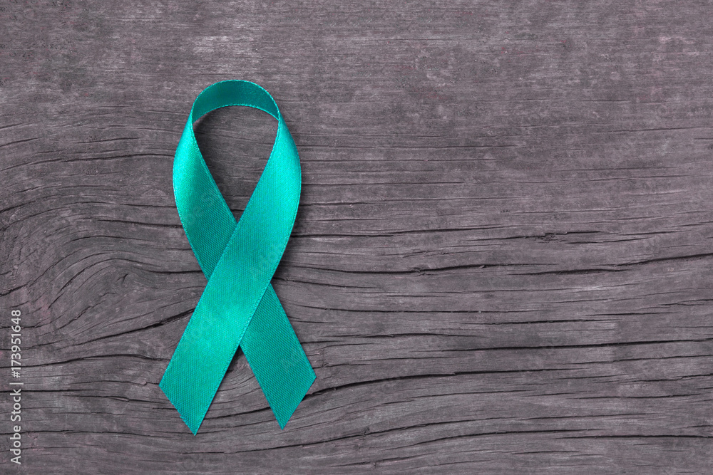Teal ribbon awareness on woman's hand for Ovarian Cancer, Polycystic ...