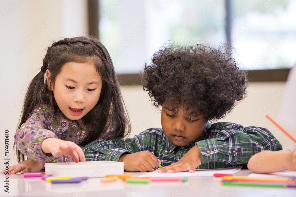 Portrait of kids learning at classroom together, Children with ...