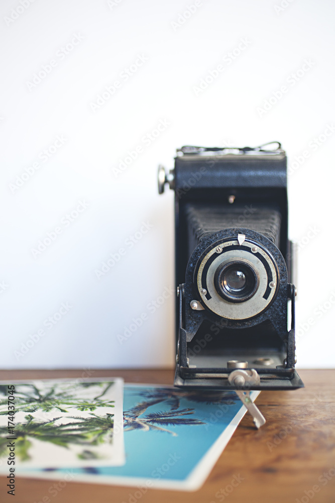 Vintage retro folding film camera with photos of palm trees Stock Photo ...