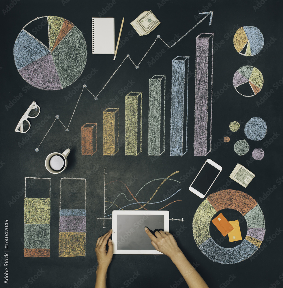 Workspace with various charts on chalkboard Stock Photo | Adobe Stock