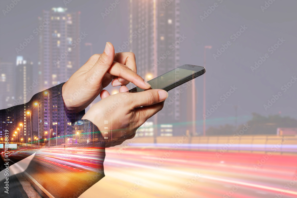 Double exposure of woman hand touch screen smartphone, mobile, light ...