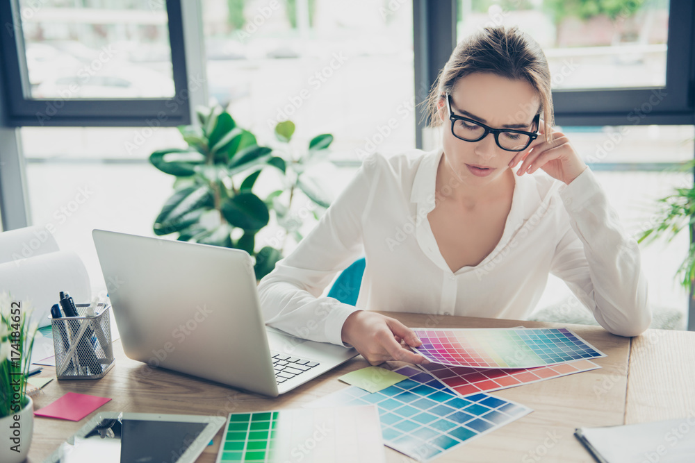 Successful attractive business lady designer is sitting at office, in ...