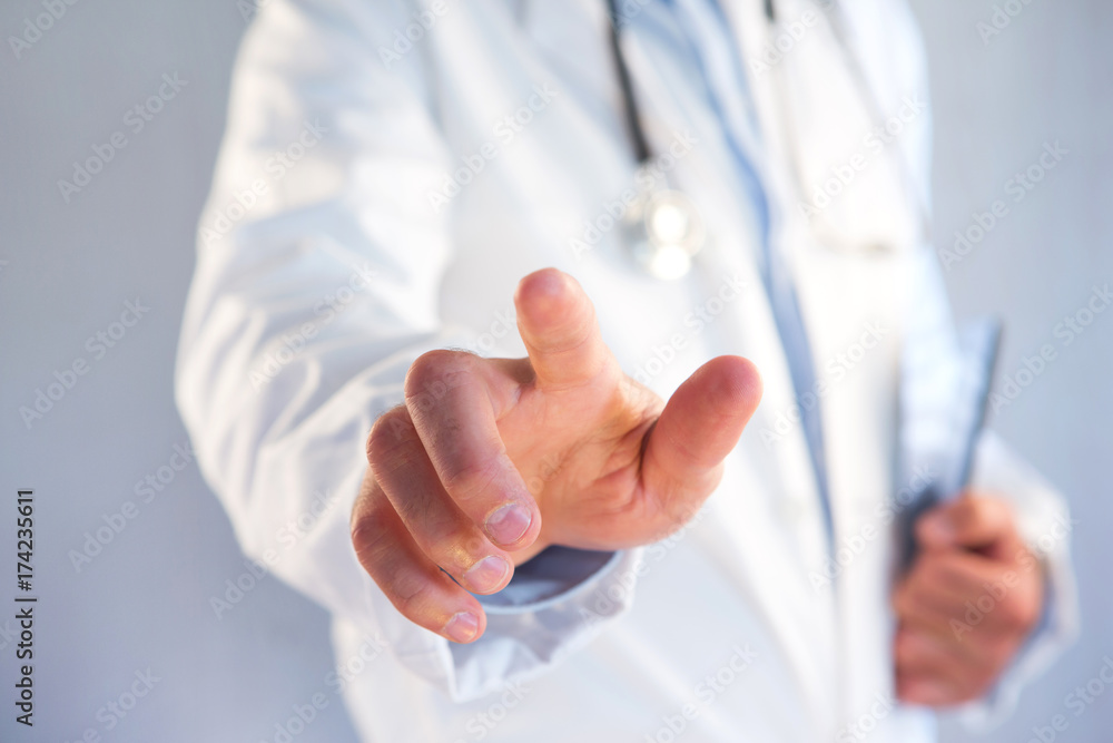 Doctor pointing his finger on a color background Stock Photo | Adobe Stock