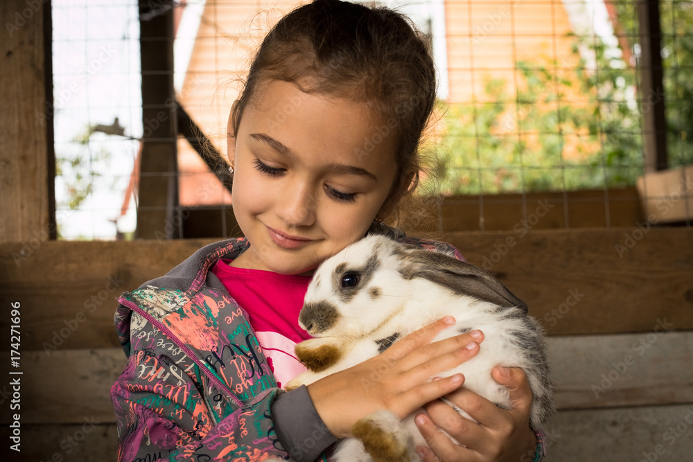 Rabbit. Cute Little Girl Holding In Her Embrace Cute Rabbit. Girl ...