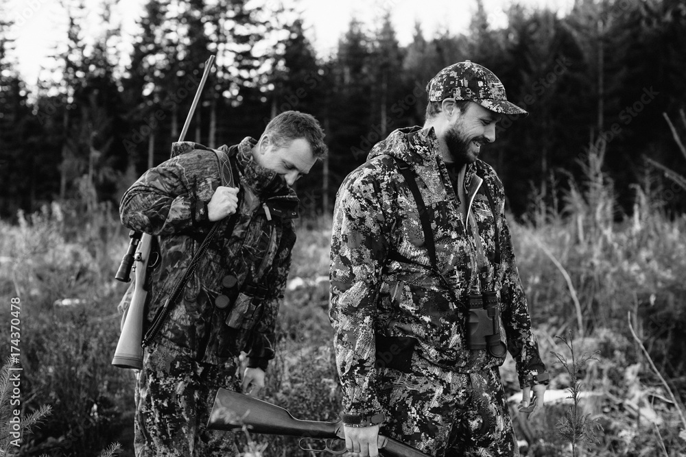 Two men enjoying hunting together Stock Photo | Adobe Stock