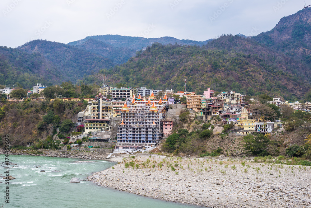 Cityscape of Rishikesh at sunset, holy town and travel destination in ...