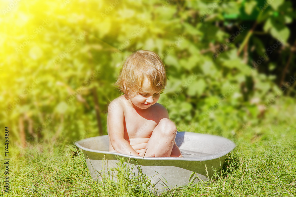 Child development in harmony with nature. Little beautiful baby girl ...