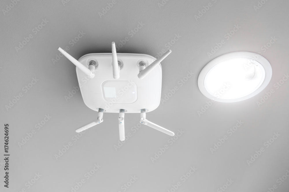 Wireless router for network hanging on white ceiling. Stock Photo ...