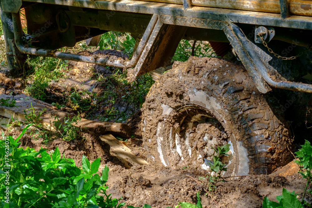 Off road wheel stuck in mud. Stock Photo | Adobe Stock
