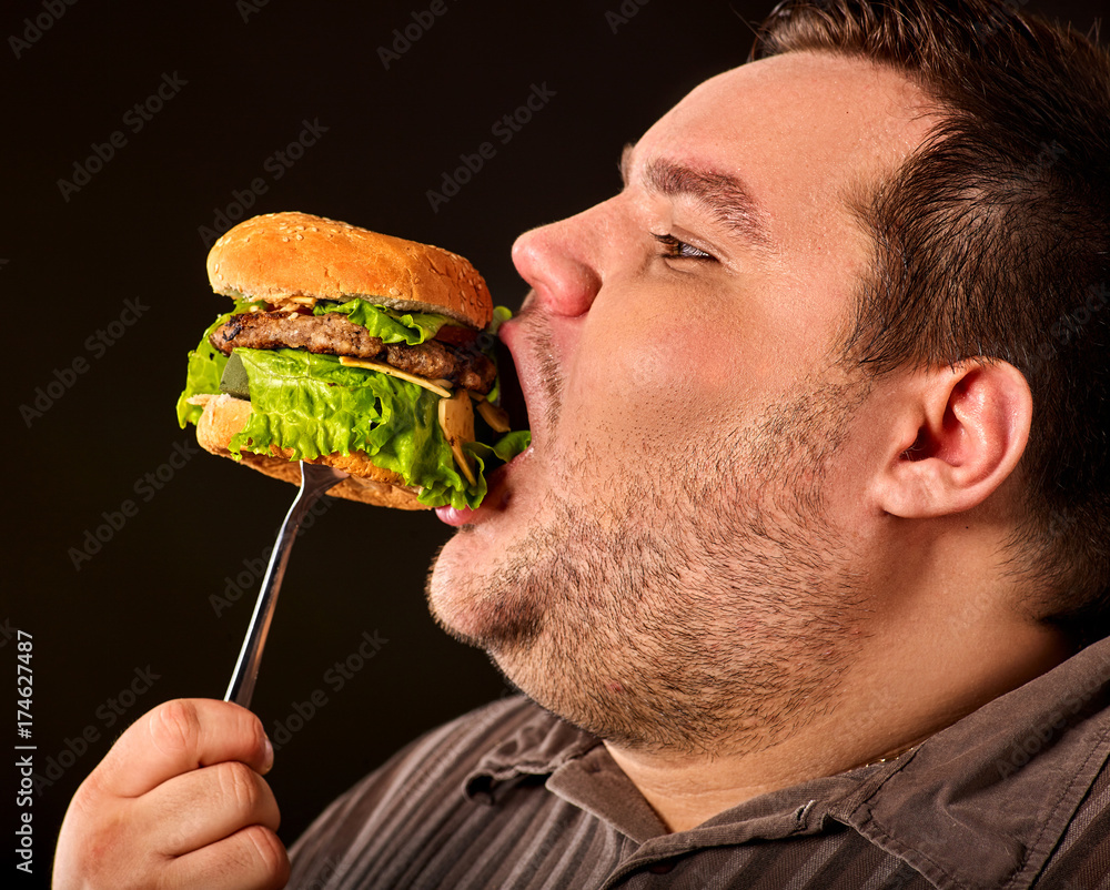 Diet failure of fat man eating fast food . Happy smile overweight ...