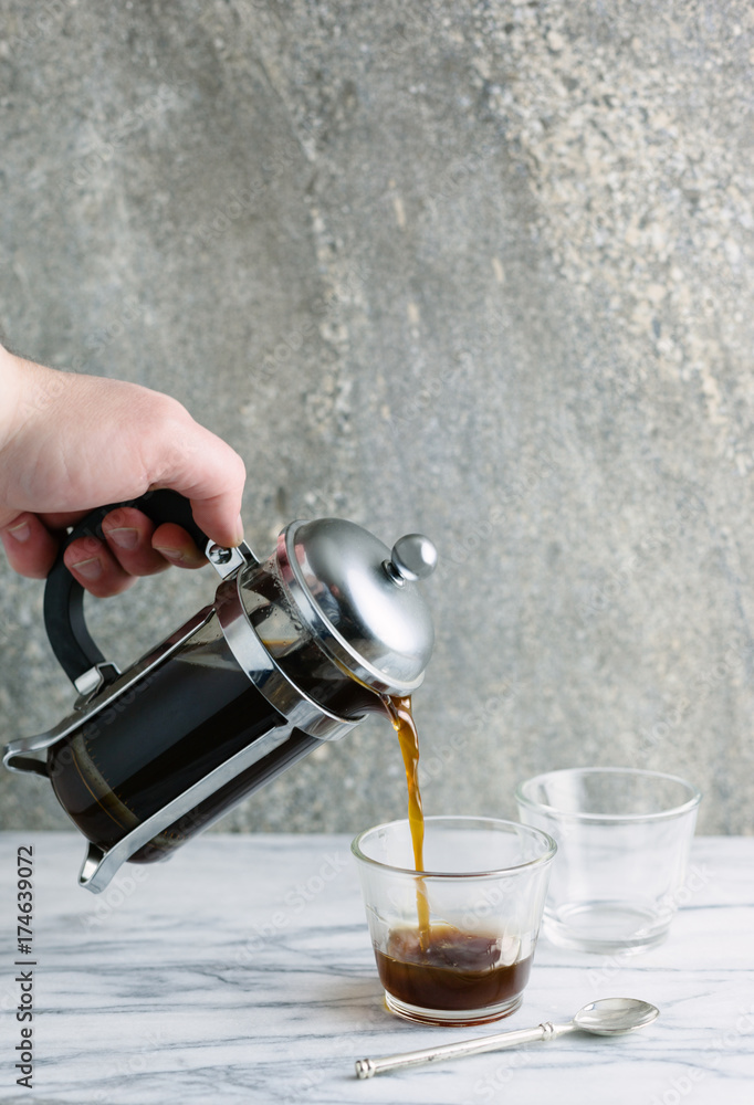Hand pouring coffee from a cafetiere into a glass. Stock Photo | Adobe ...