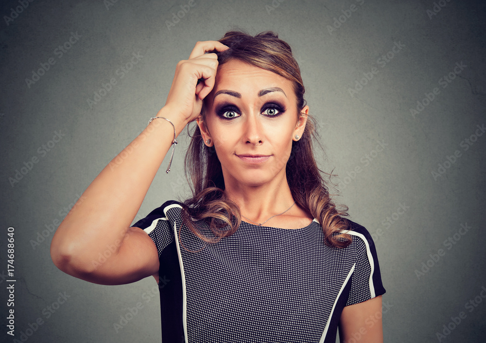Confused funny looking woman scratching head Stock-Foto | Adobe Stock