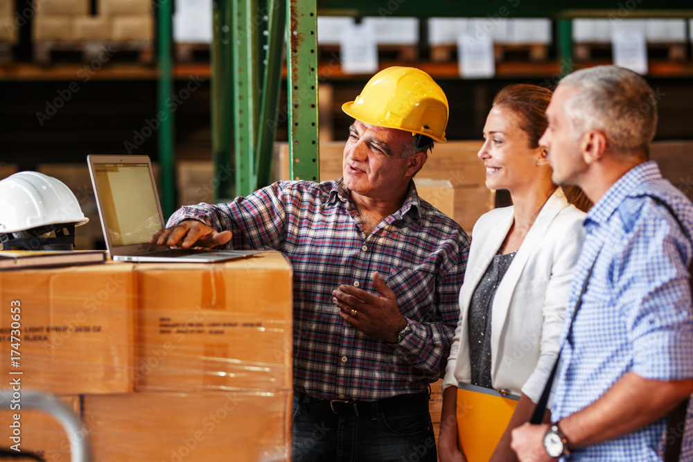 team of customs manager and warehouse worker checking list and ...