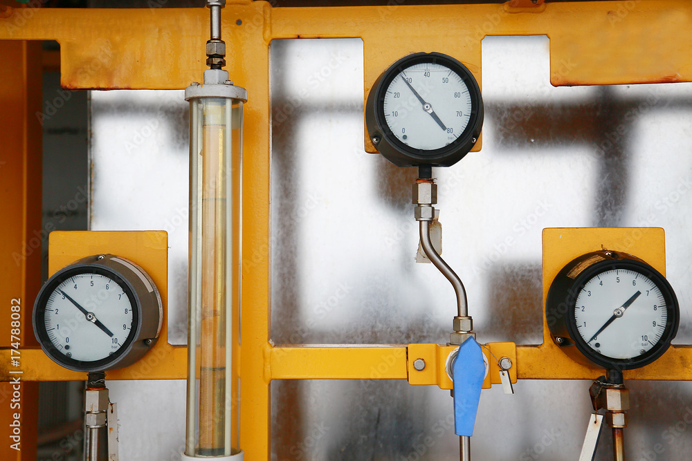 Pressure gauge using measure the pressure in production process. Worker ...