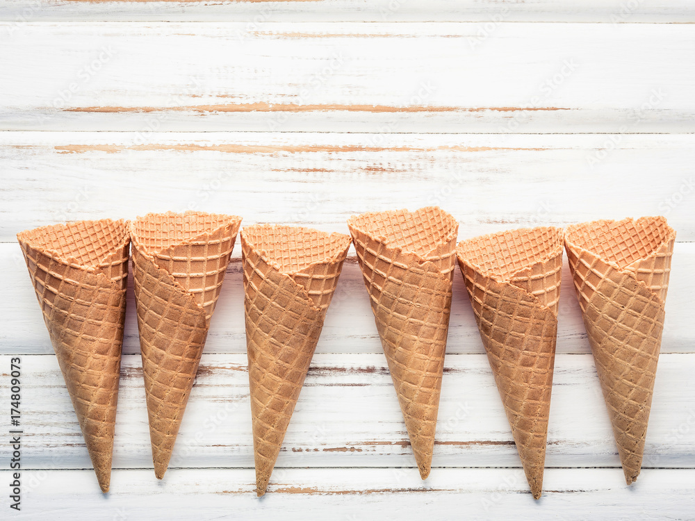 Flat lay ice cream cones collection on white wooden background . Blank ...
