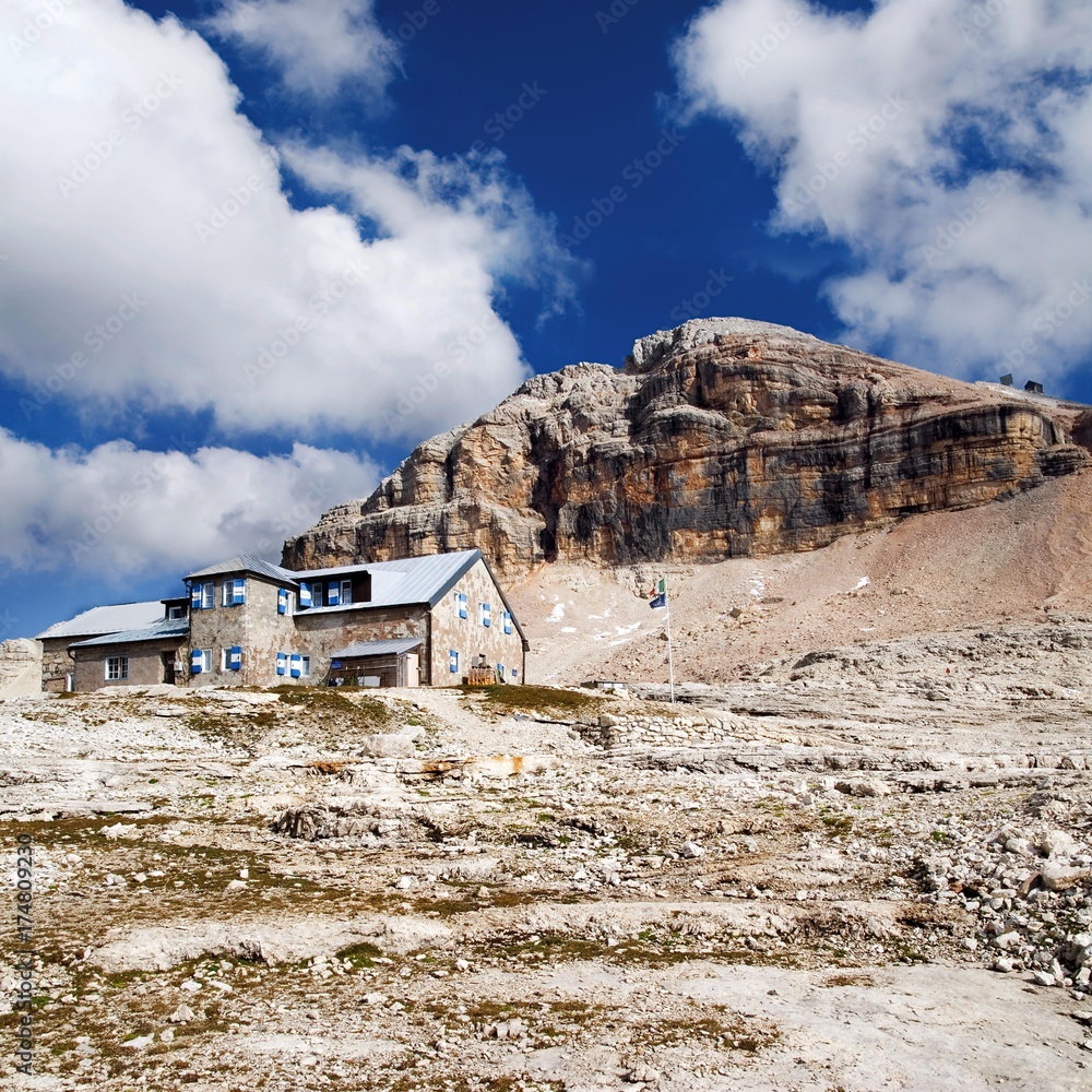 Piz Boe peak with the Bamberger Huette hut and bizarre cloud formations, Sella massif, Passo ...