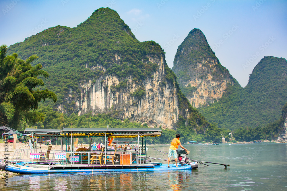 Tourist cruise boat on a Li river in Yangshuo, famous travel spot in ...